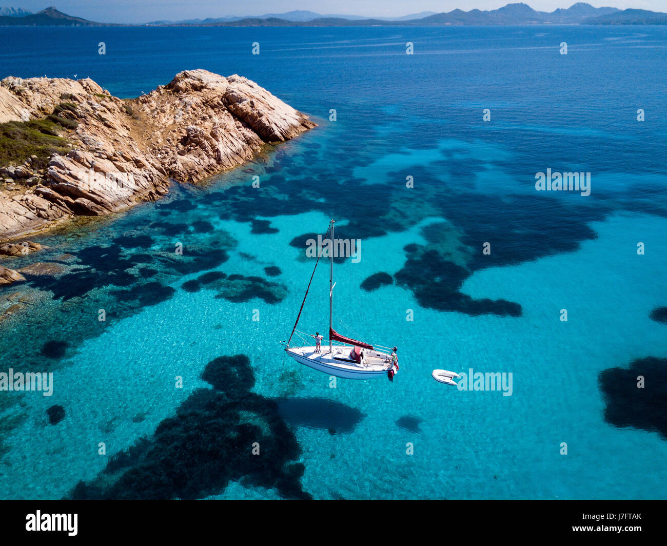 Aerial view of a boat in front of the Mortorio island in Sardinia ...