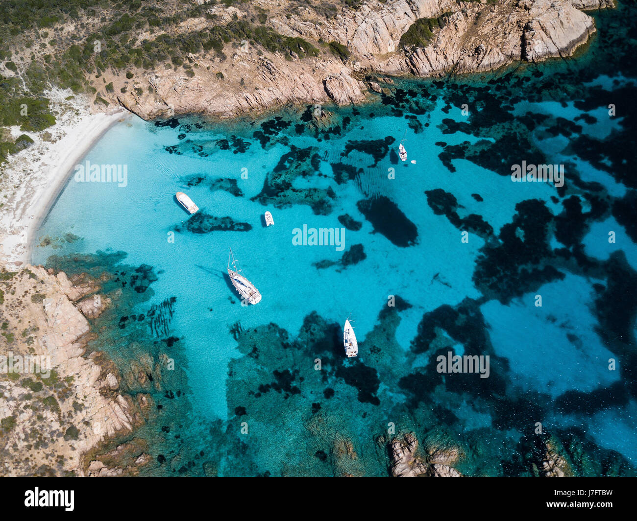 Aerial view of a boat in front of the Mortorio island in Sardinia ...