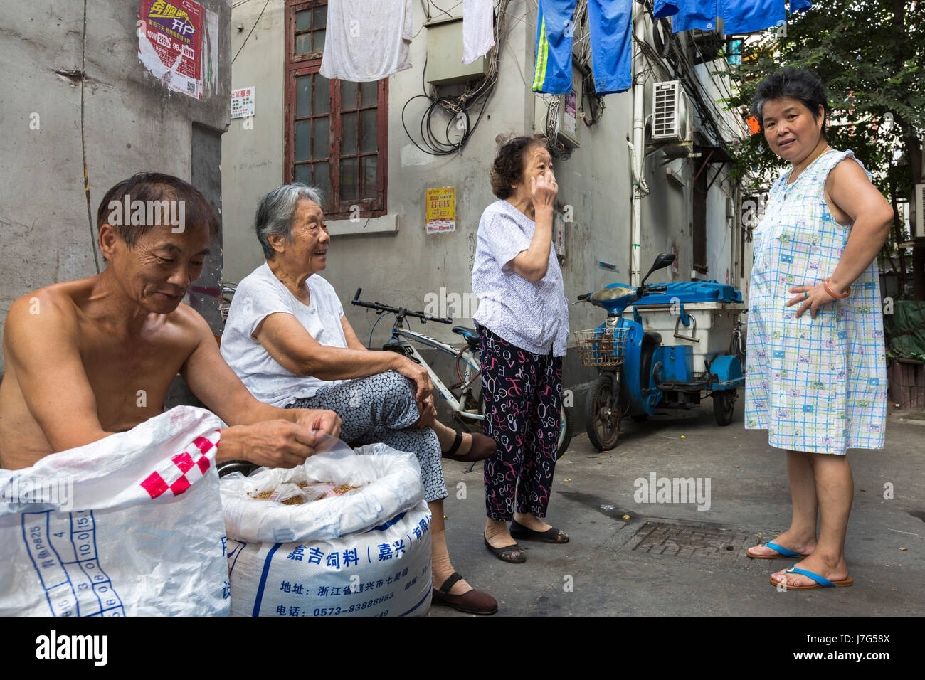 Senior citizens in old residential housing estate, Shanghai, China ...