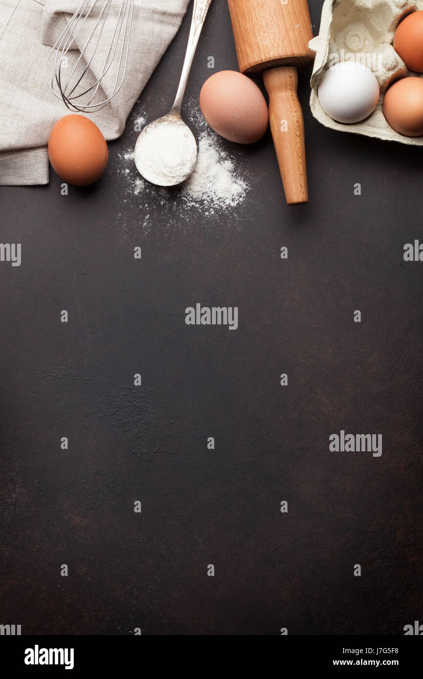 Cooking ingredients on wooden kitchen table. Top view with space for ...