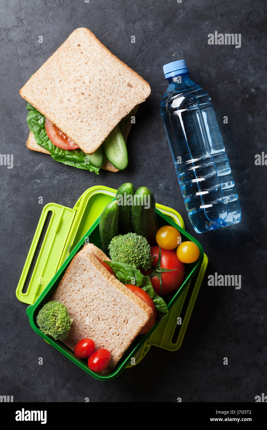 Lunch box with sandwich and vegetables. Top view Stock Photo - Alamy
