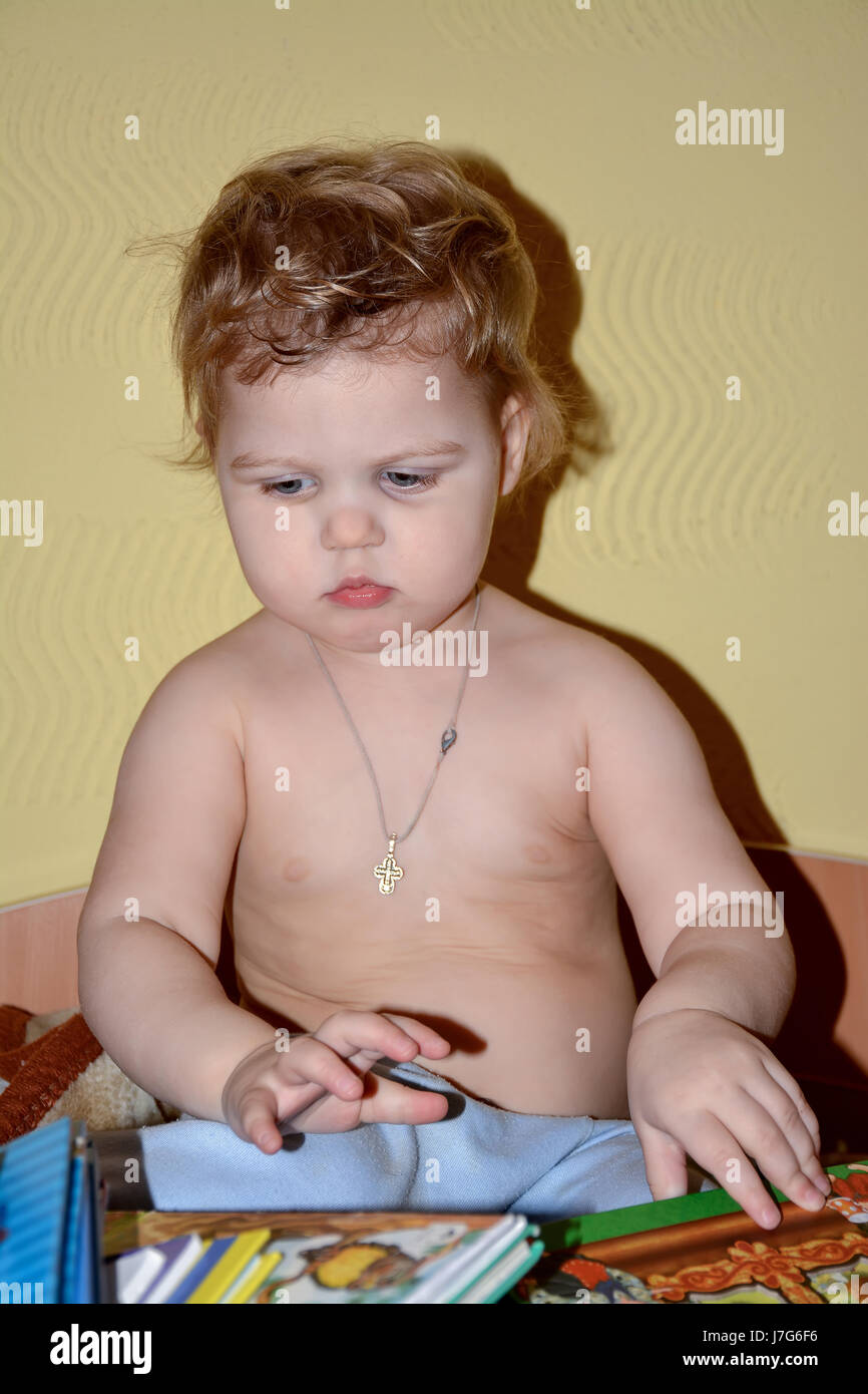 The little girl thumbed children's books Stock Photo - Alamy