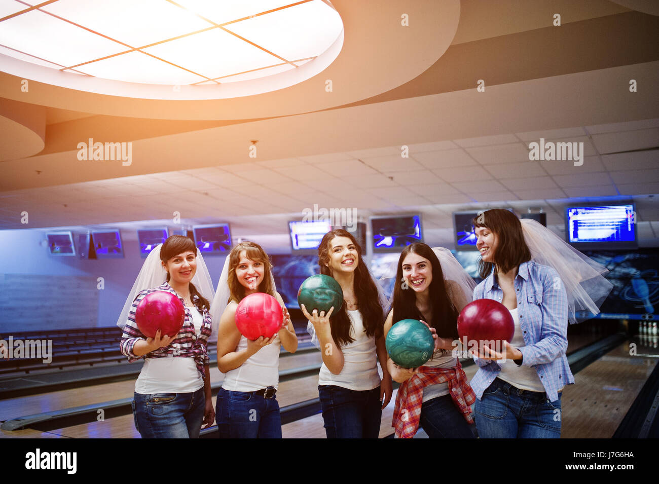 Group of six girls wit bowling balls at hen party on bowling club Stock ...