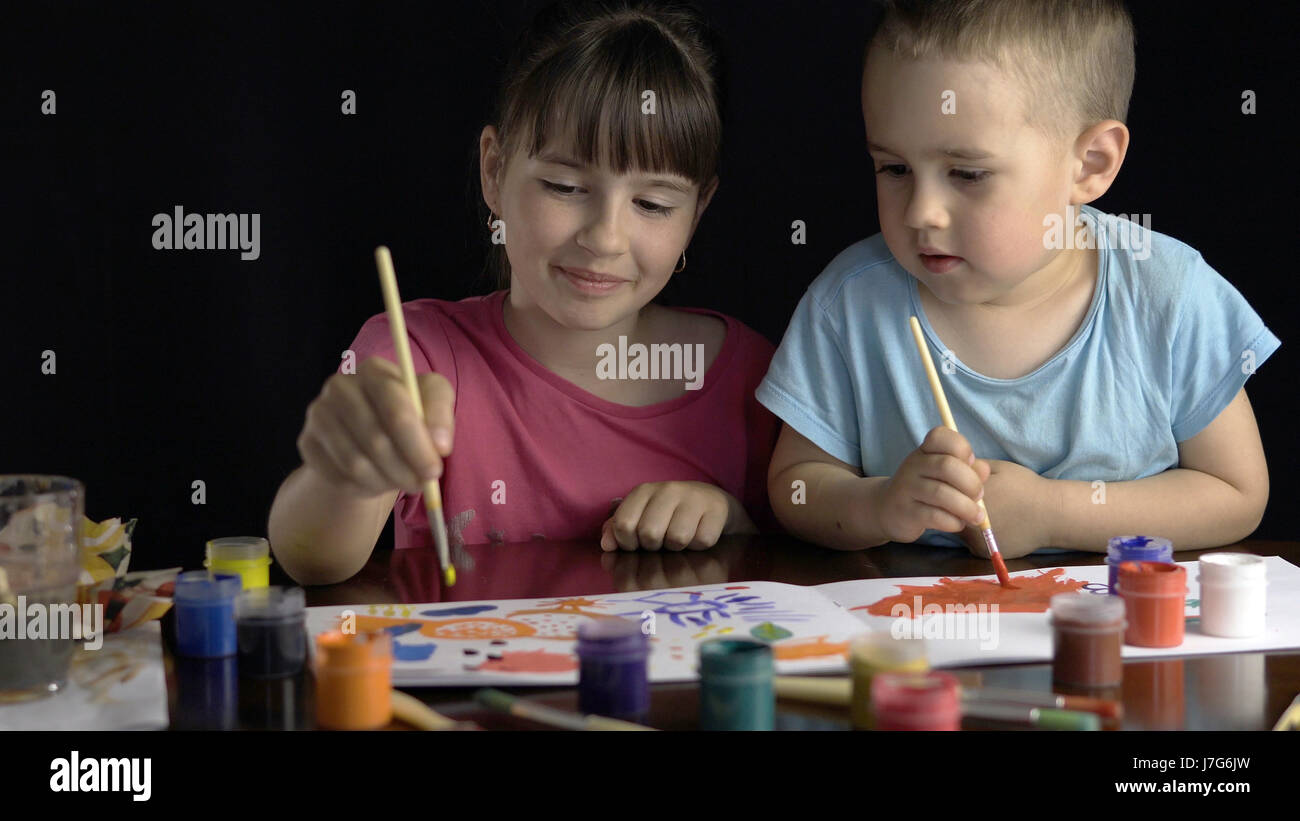 Happy Painting by Two Kids Stock Photo - Alamy