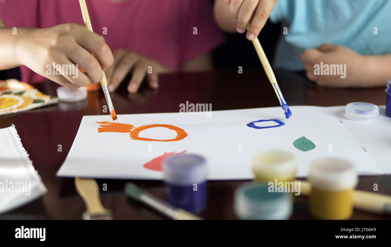 Happy Painting by Two Kids Stock Photo - Alamy