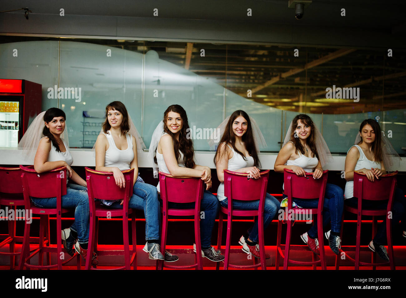 Girls on stools hi-res stock photography and images - Alamy