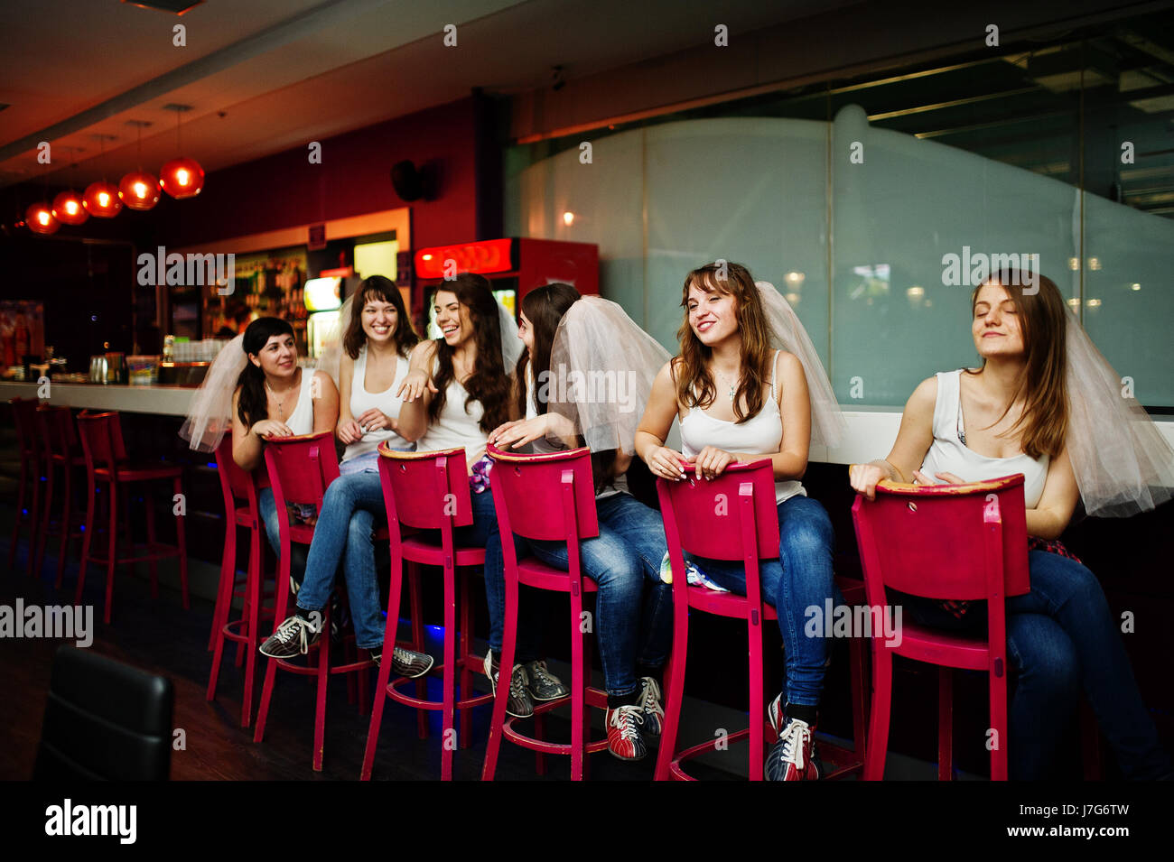 Girls on stools hi-res stock photography and images - Alamy