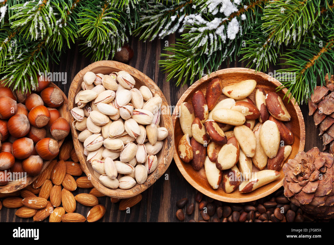 Various nuts on wooden table. Top view Stock Photo - Alamy