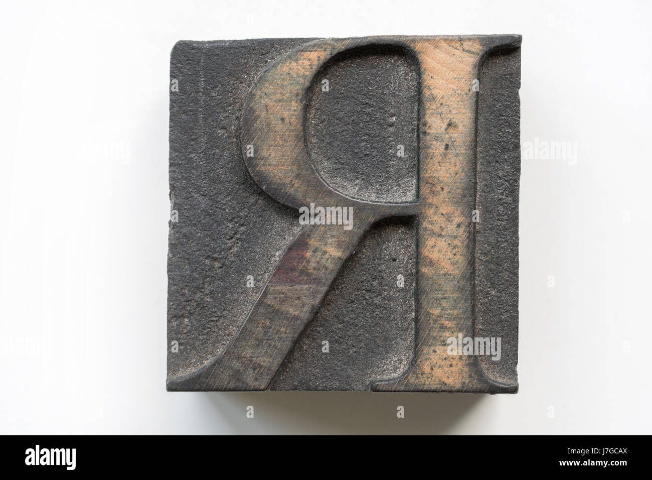 Old letter r letterpress printing block isolated on a white background ...