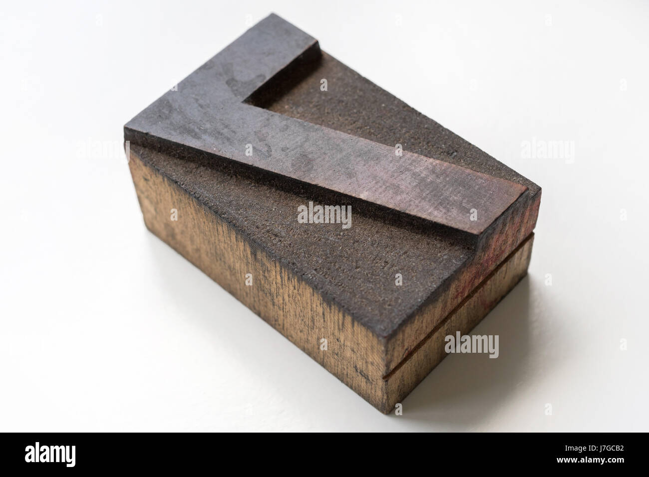 Old number seven letterpress printing block isolated on a white ...