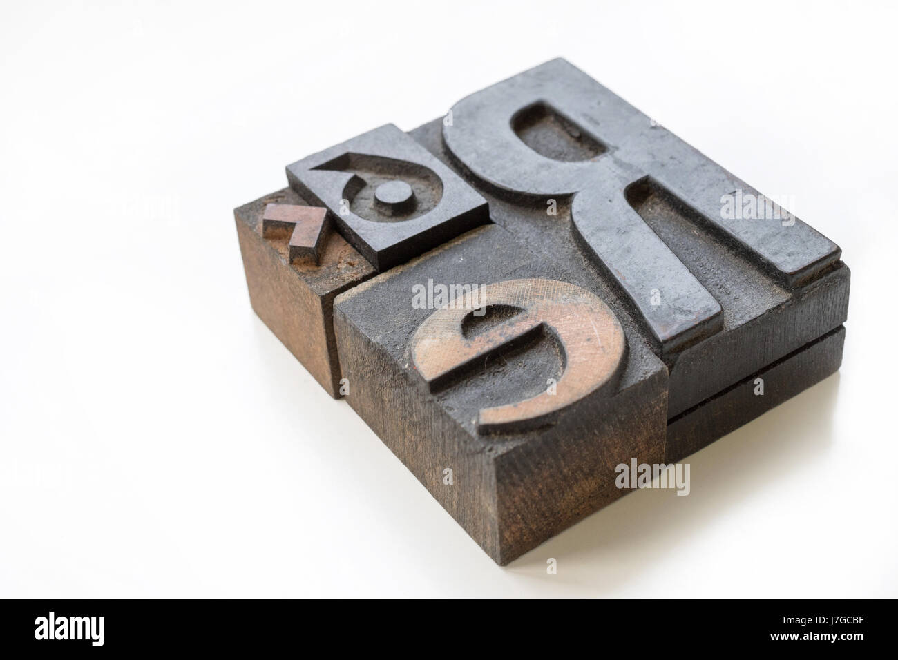 Old letterpress printing blocks isolated on a white background Stock ...