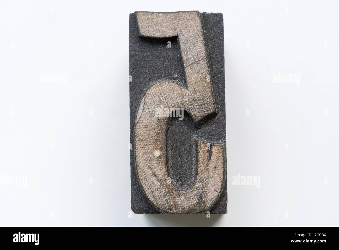 Old number five letterpress printing block isolated on a white ...