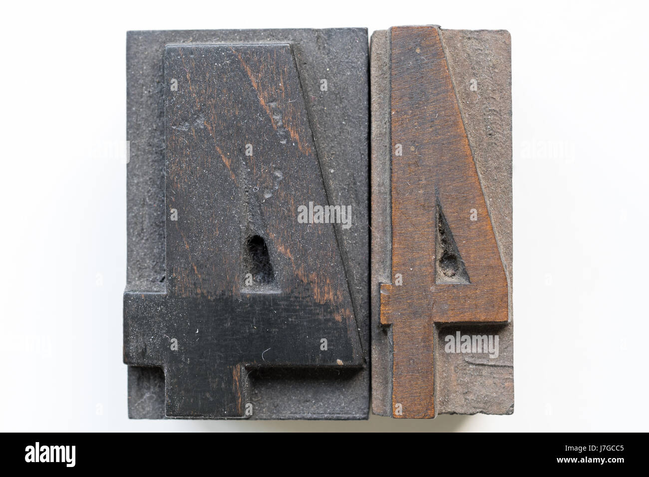 Old number four letterpress printing block isolated on a white ...