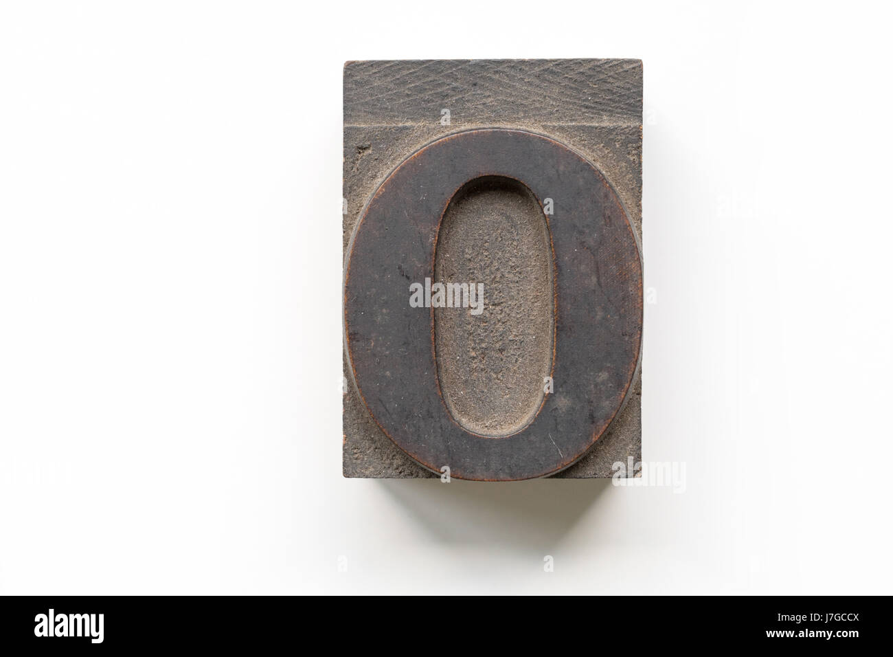 Old number zero letterpress printing block isolated on a white ...