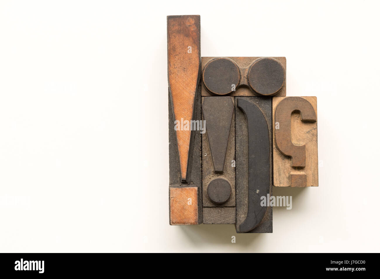 Old punctuation letterpress printing blocks isolated on a white ...
