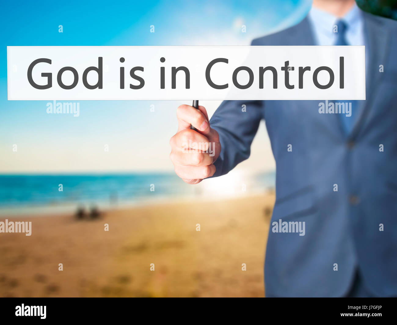 God is in Control - Businessman hand holding sign. Business, technology ...