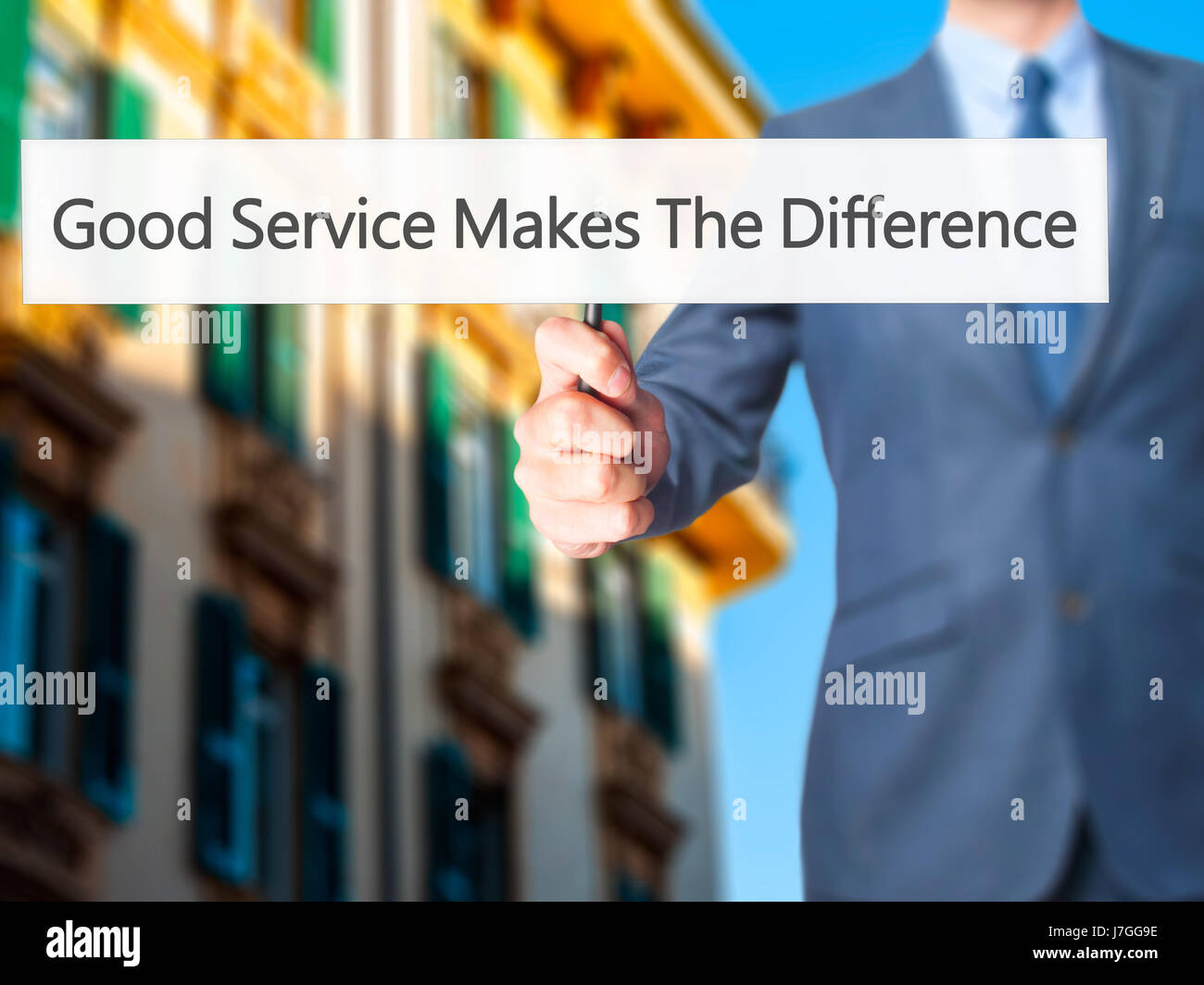 Good Service Makes The Difference - Businessman hand holding sign ...