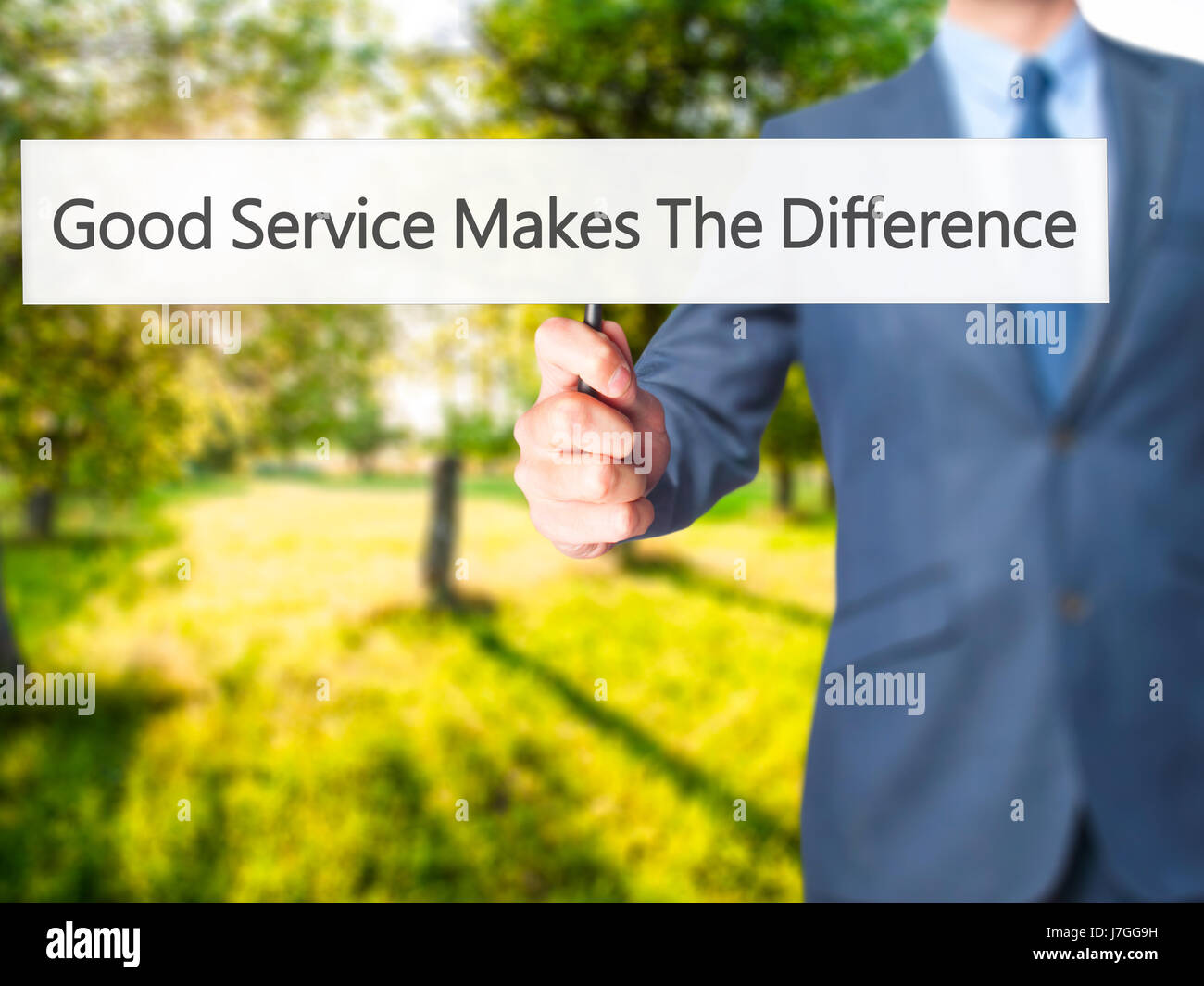 Good Service Makes The Difference - Businessman hand holding sign ...