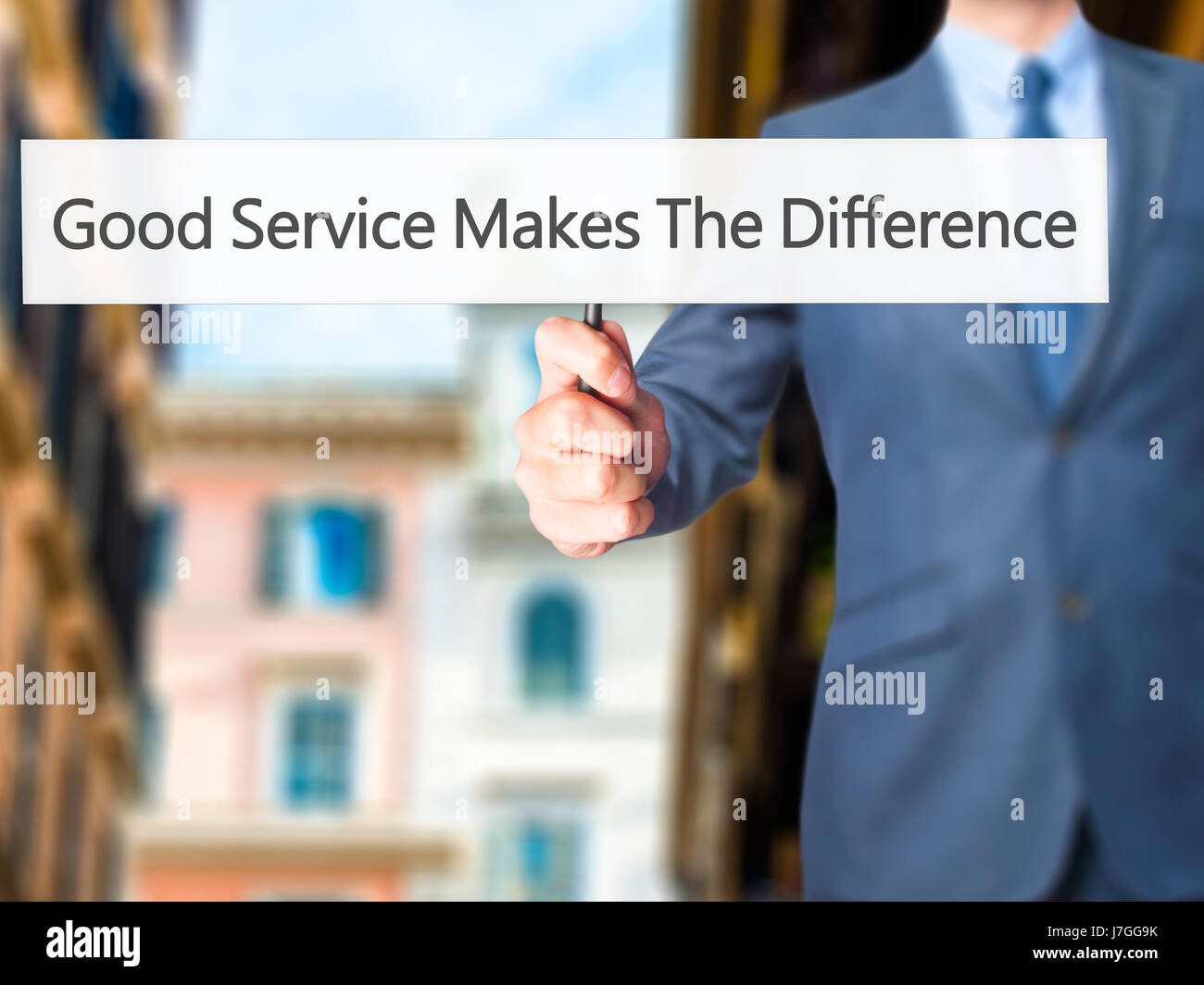 Good Service Makes The Difference - Businessman hand holding sign ...