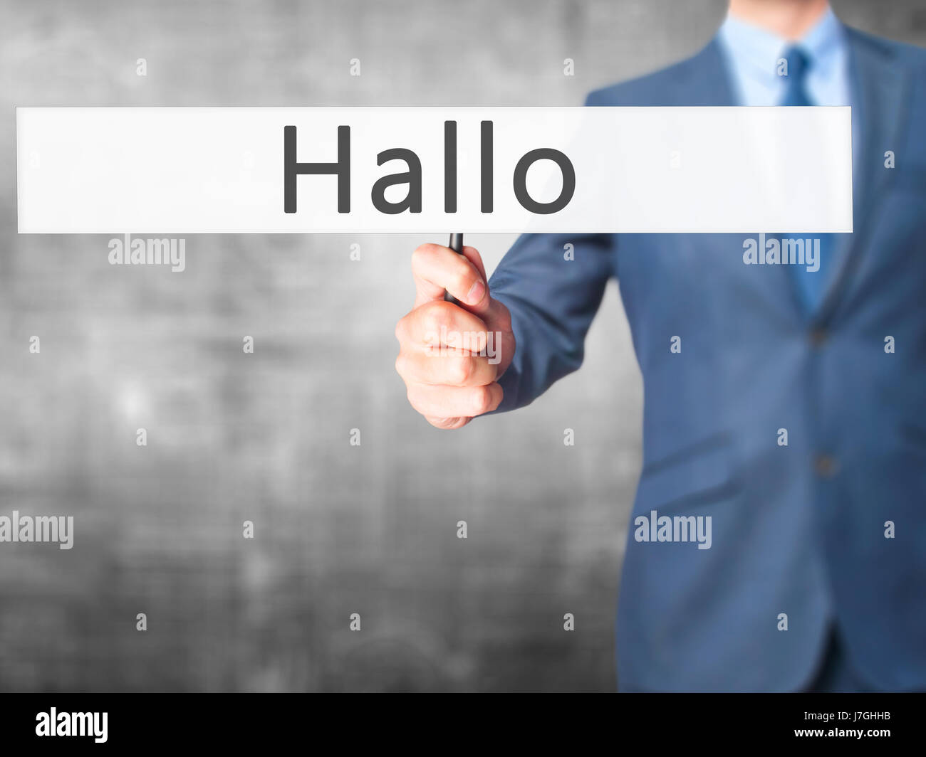 Hallo (Hello in German) - Businessman hand holding sign. Business ...