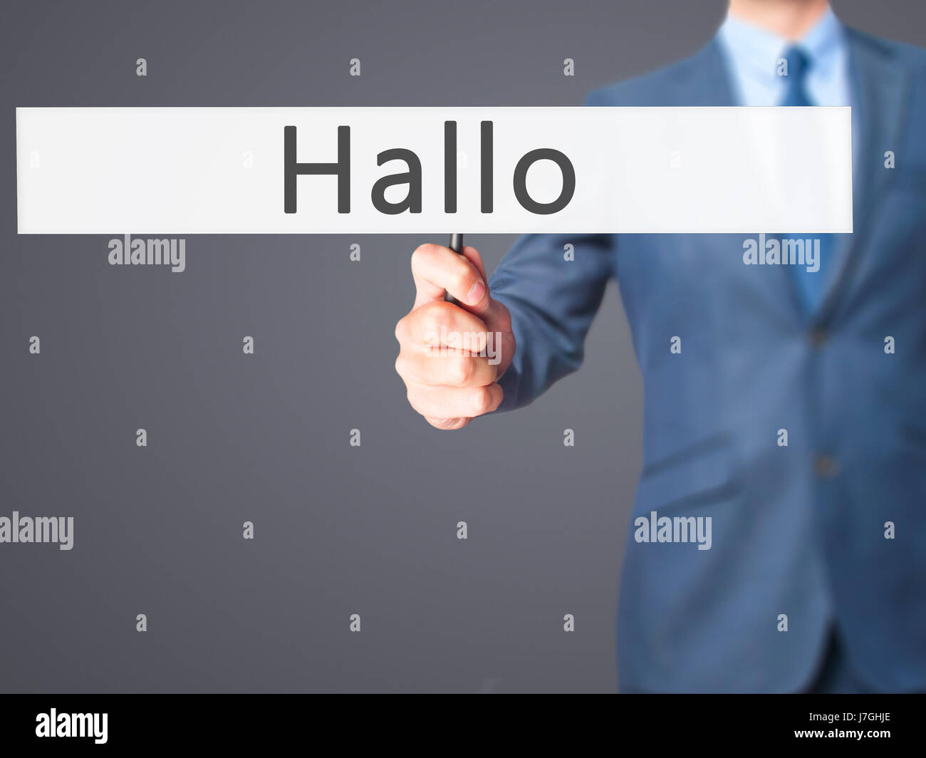 Hallo (Hello in German) - Businessman hand holding sign. Business ...