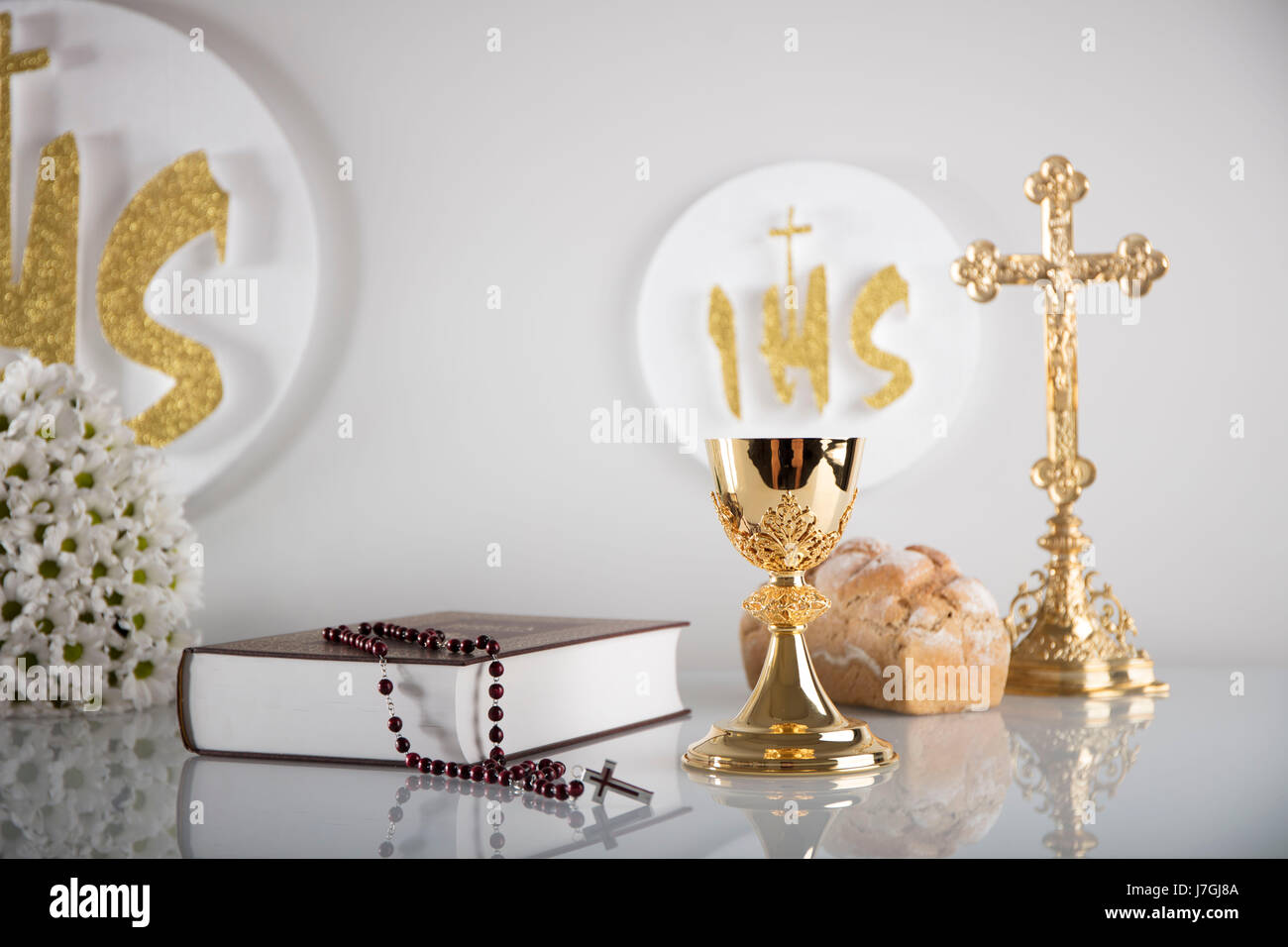 First Holy Communion. Catholic religion theme. Crucifix, Bible, bread ...