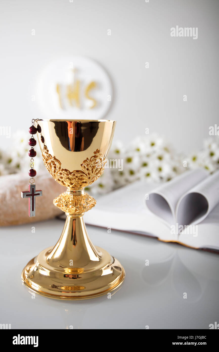 First Holy Communion. Catholic religion theme. Crucifix, Bible, bread ...