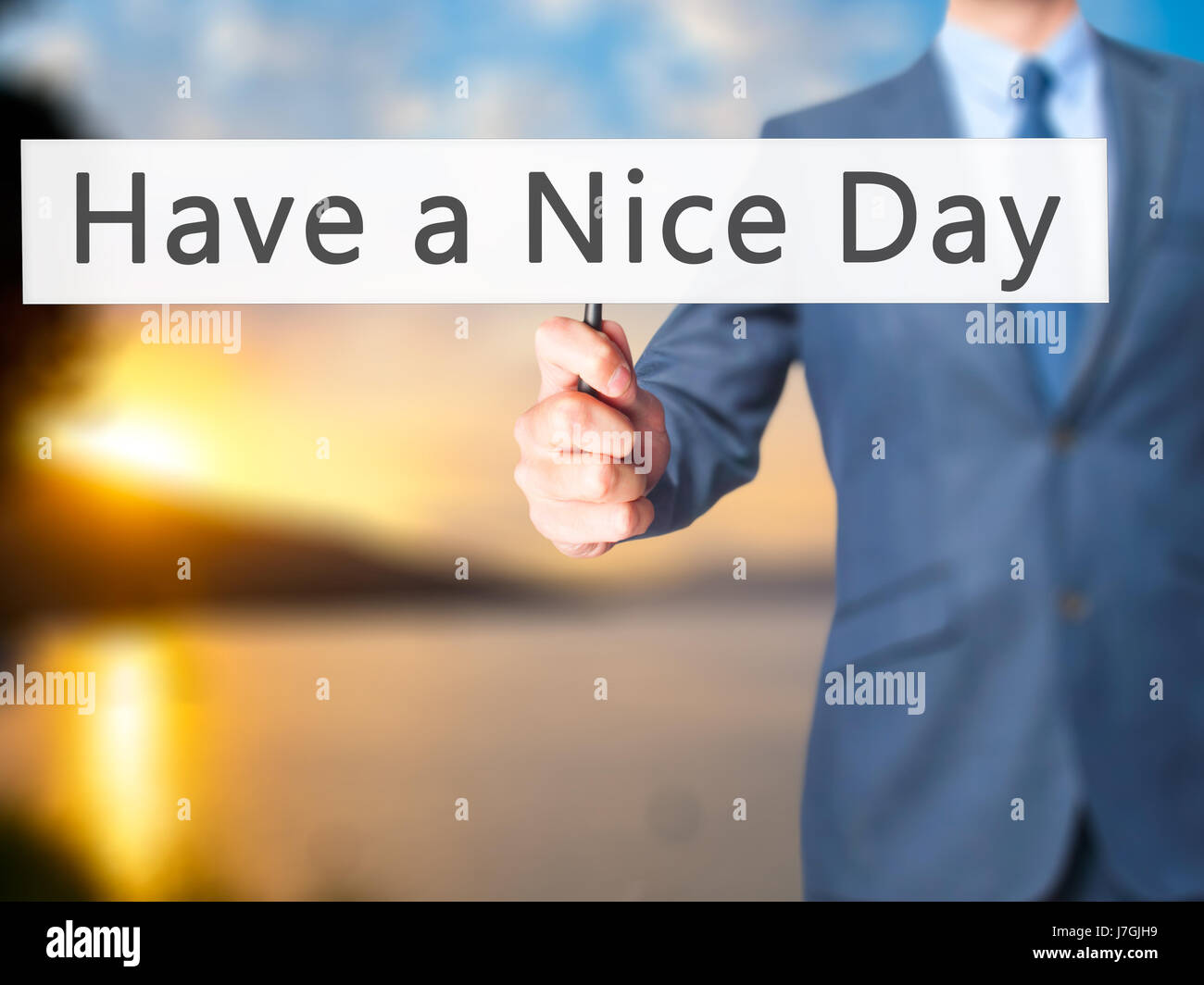 Have a Nice Day - Businessman hand holding sign. Business, technology ...