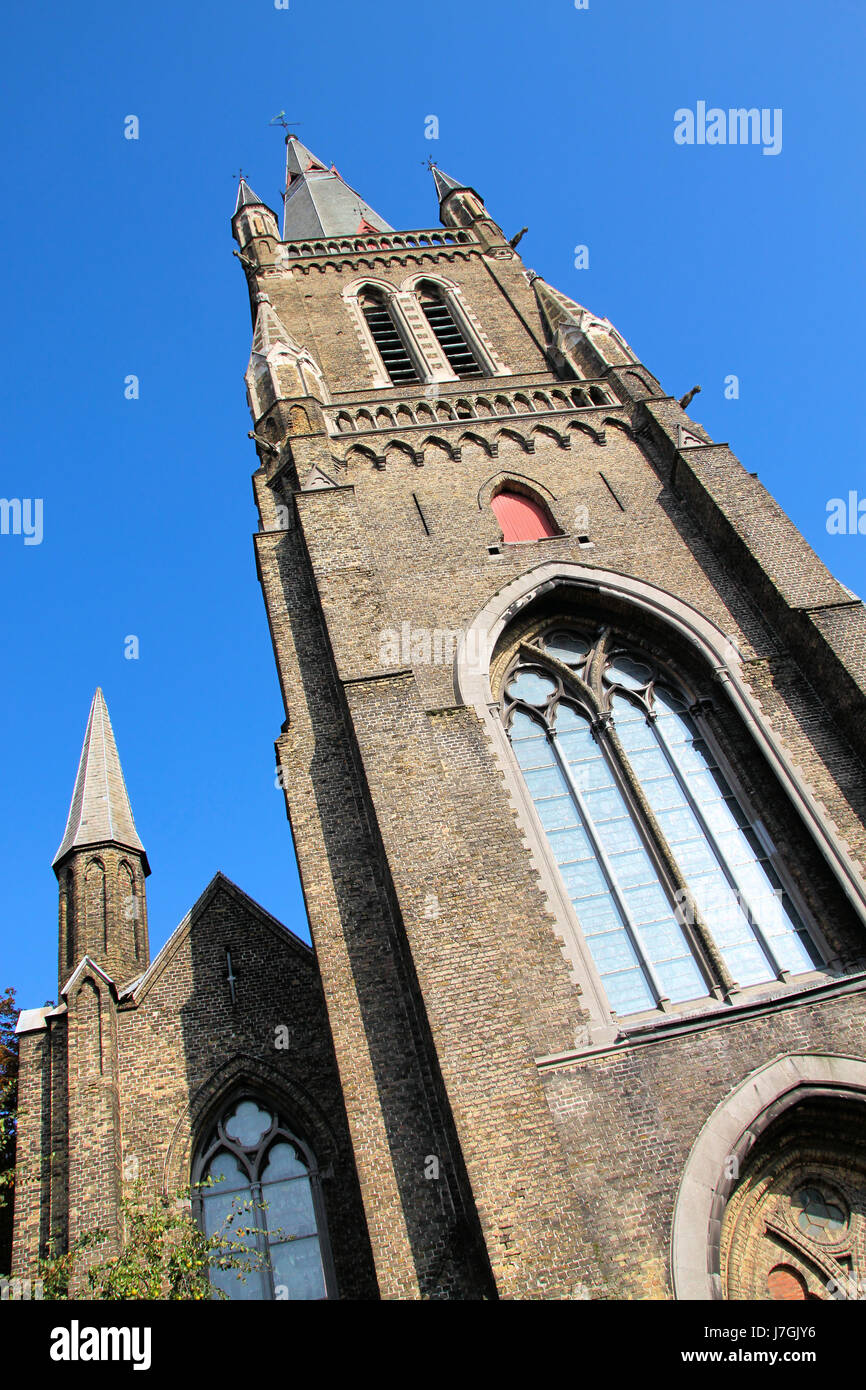 church belgium steeple bruges blue tower church window porthole dormer ...
