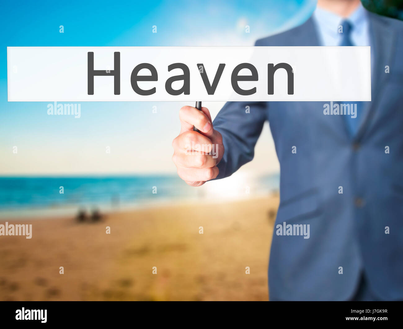 Heaven - Businessman hand holding sign. Business, technology, internet ...