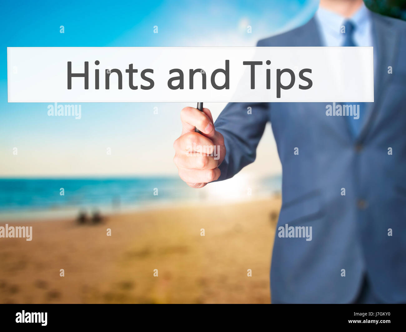 Hints and Tips - Businessman hand holding sign. Business, technology ...