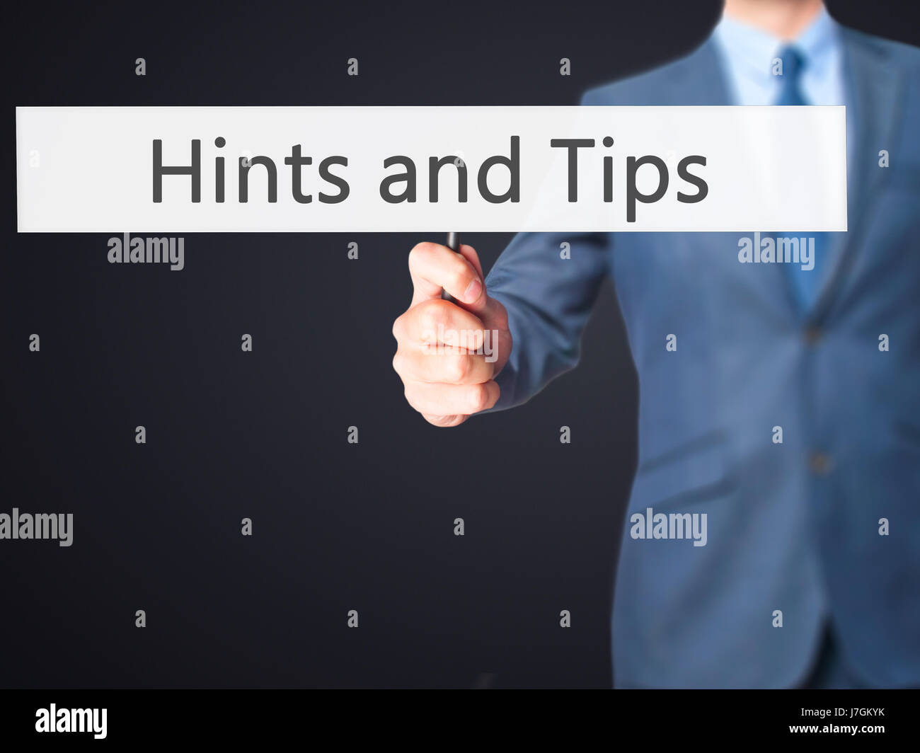 Hints and Tips - Businessman hand holding sign. Business, technology ...