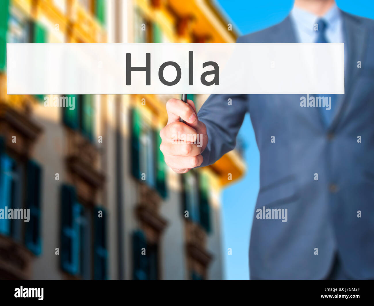 Hola - Businessman hand holding sign. Business, technology, internet ...