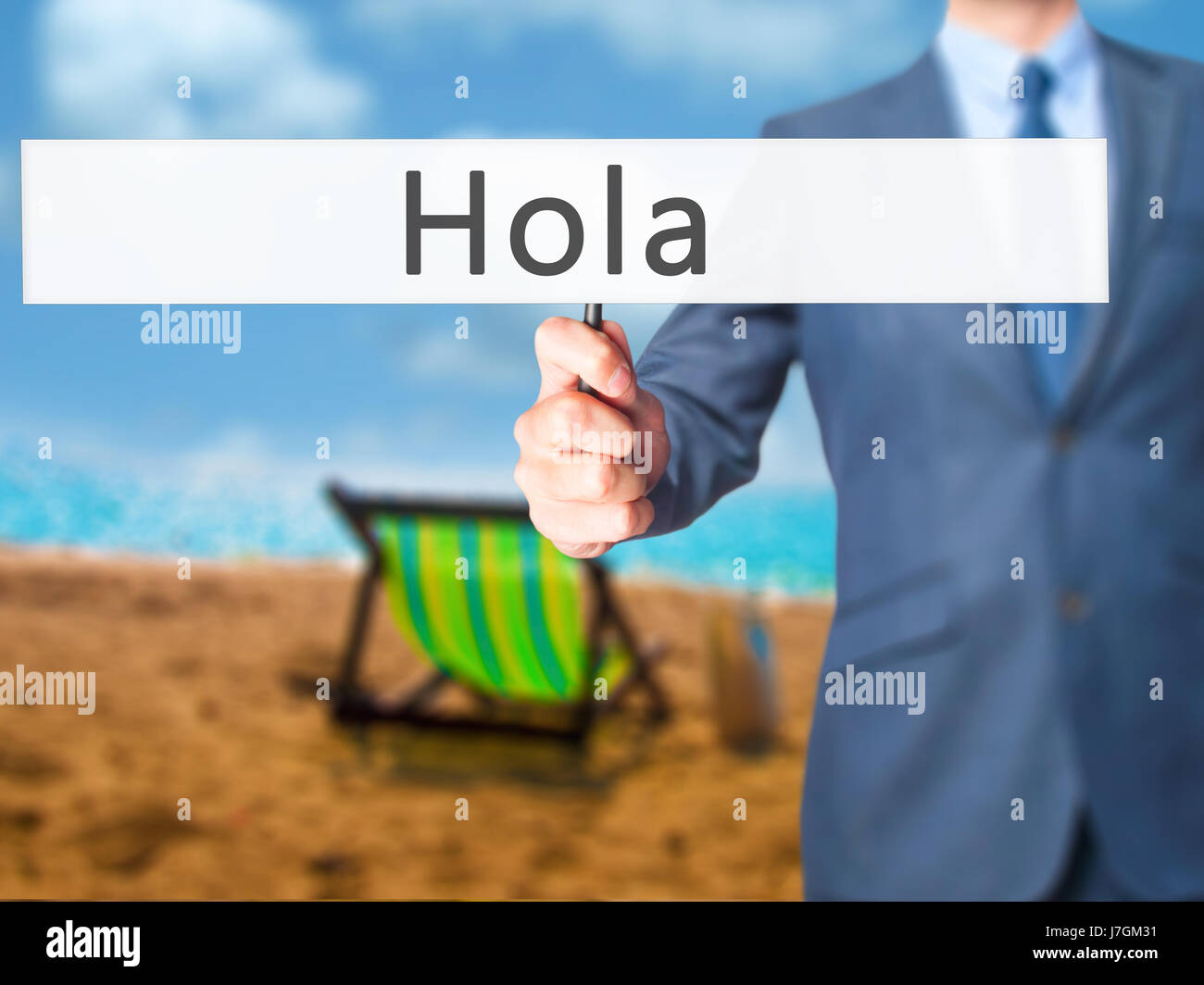 Hola - Businessman hand holding sign. Business, technology, internet ...