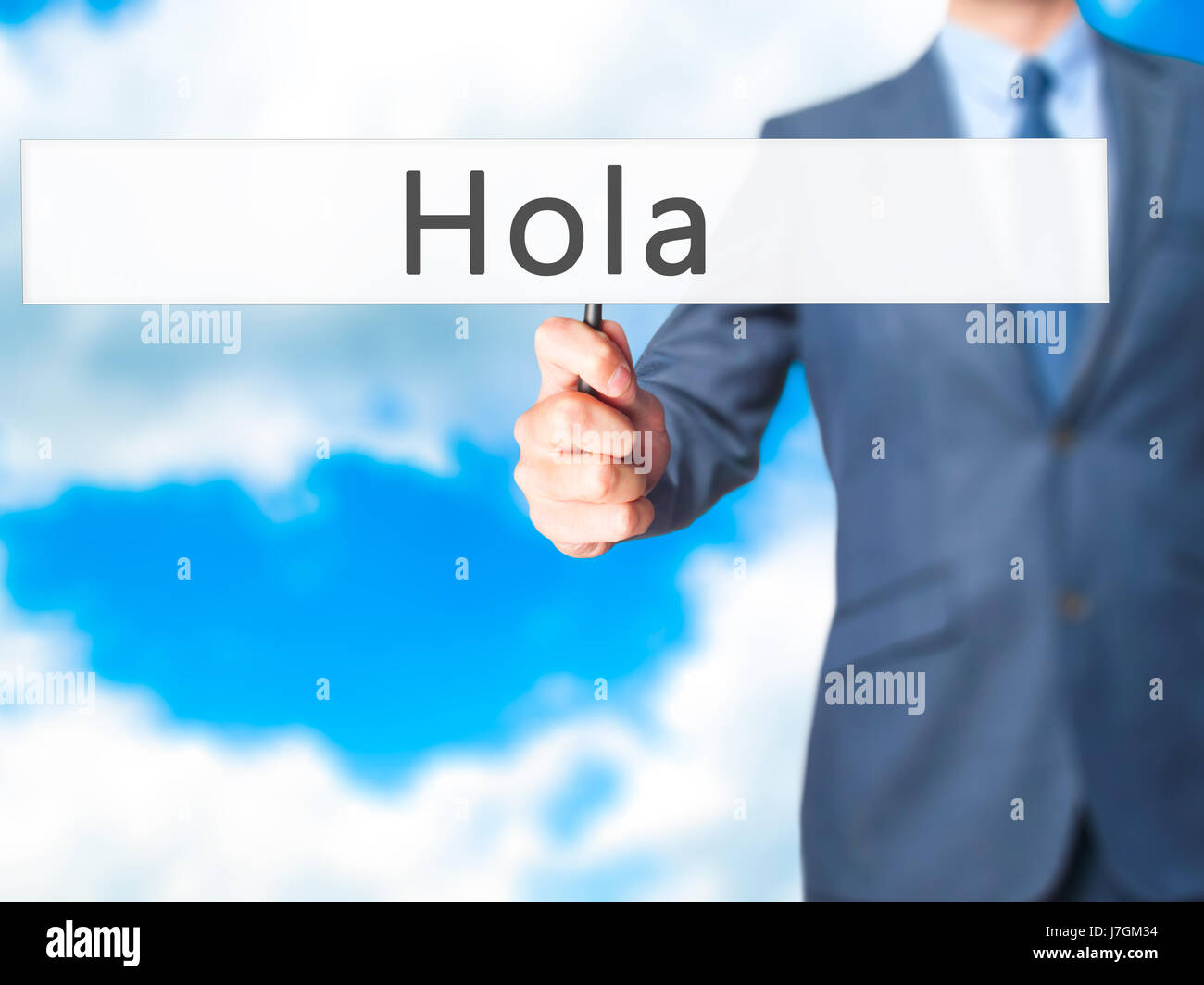 Hola - Businessman hand holding sign. Business, technology, internet ...