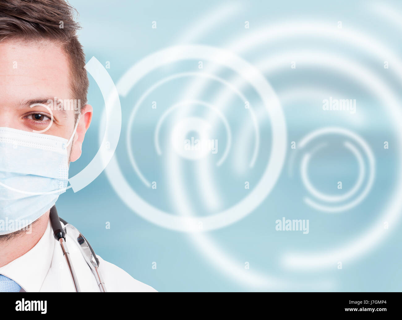 Half portrait of medic or surgeon in closeup view behind modern screen ...