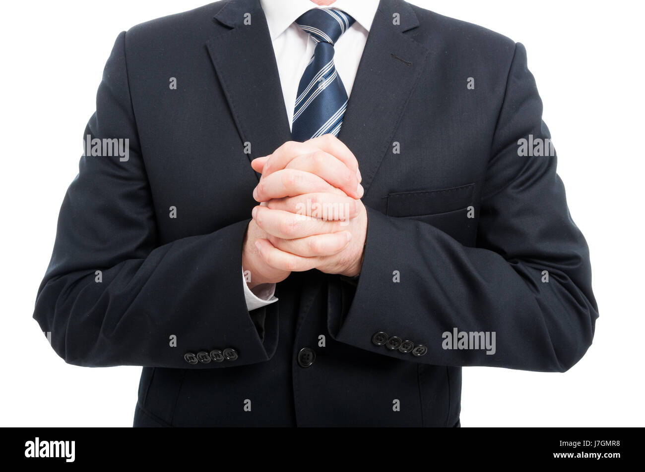 Close-up of elegant man holding his hands crossed wearing suit and tie ...