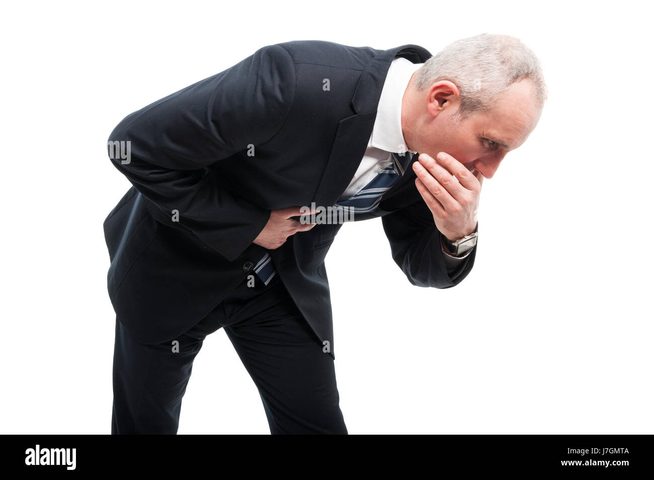 Portrait of senior holding his stomach and throwing up wearing suit and ...