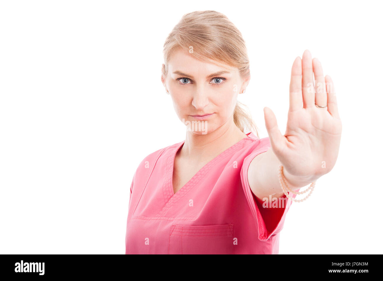 Handsome medical female nurse making stop gesture with one hand ...