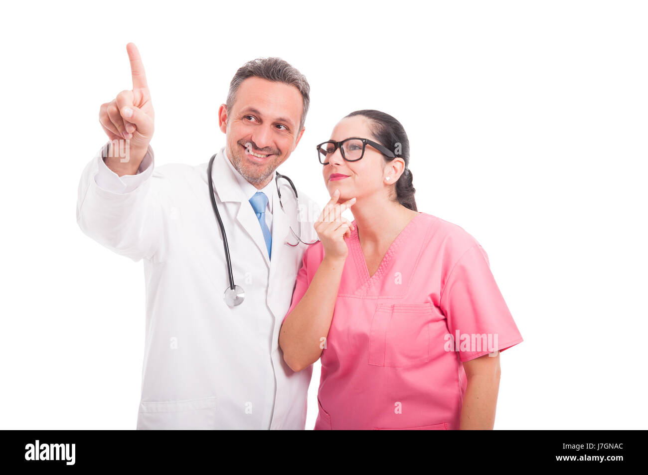 Medical doctor pointing up or indicate something to female nurse as ...