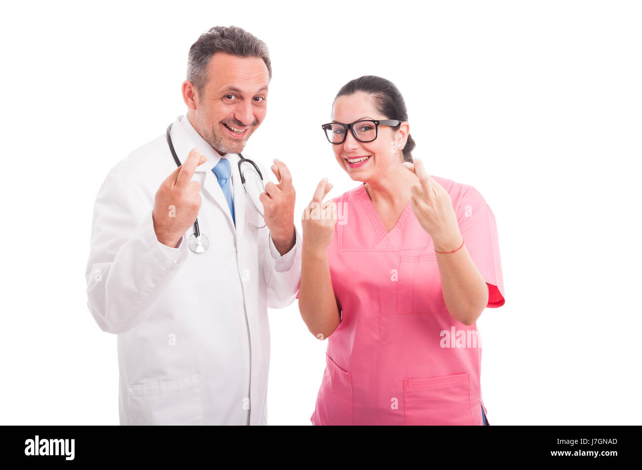 Joyful medical team indicate good luck sign for good treatment results ...
