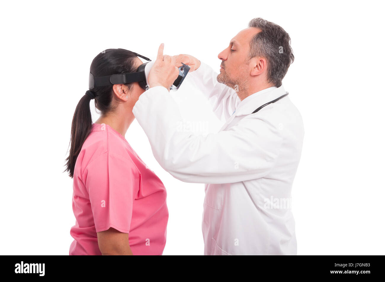 Attractive nurse experience virtual reality thru vr headset near male ...