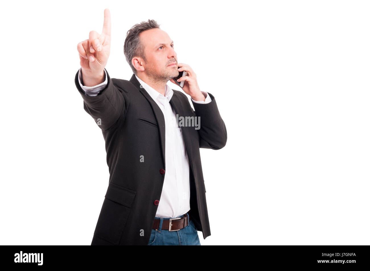 Handsome entrepreneur doing hold on gesture while calling somebody on ...