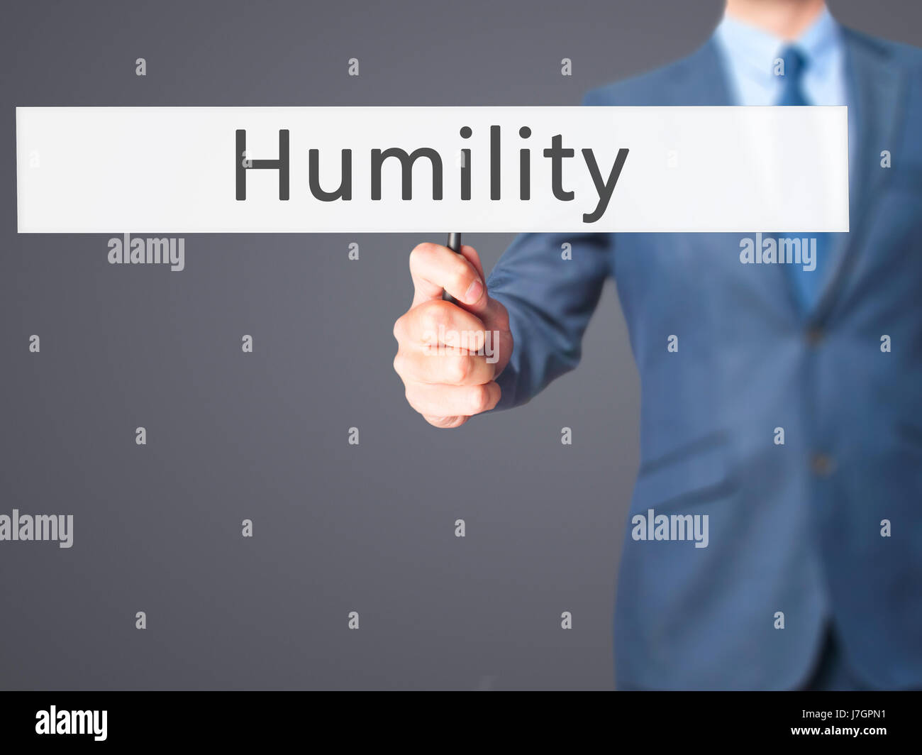 Humility - Businessman hand holding sign. Business, technology ...