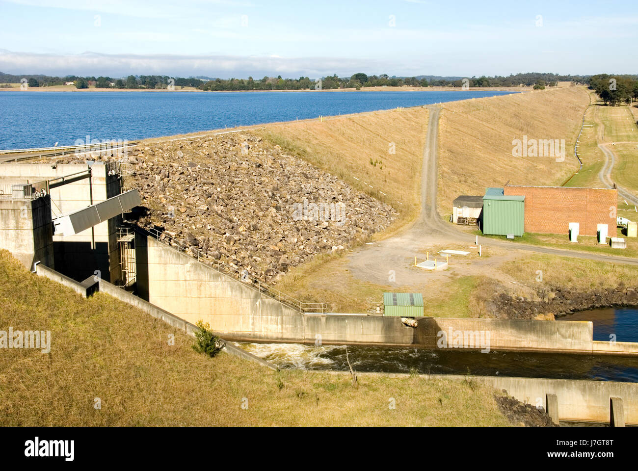 blue buildings tree trees australia concrete wall dam barrier ...