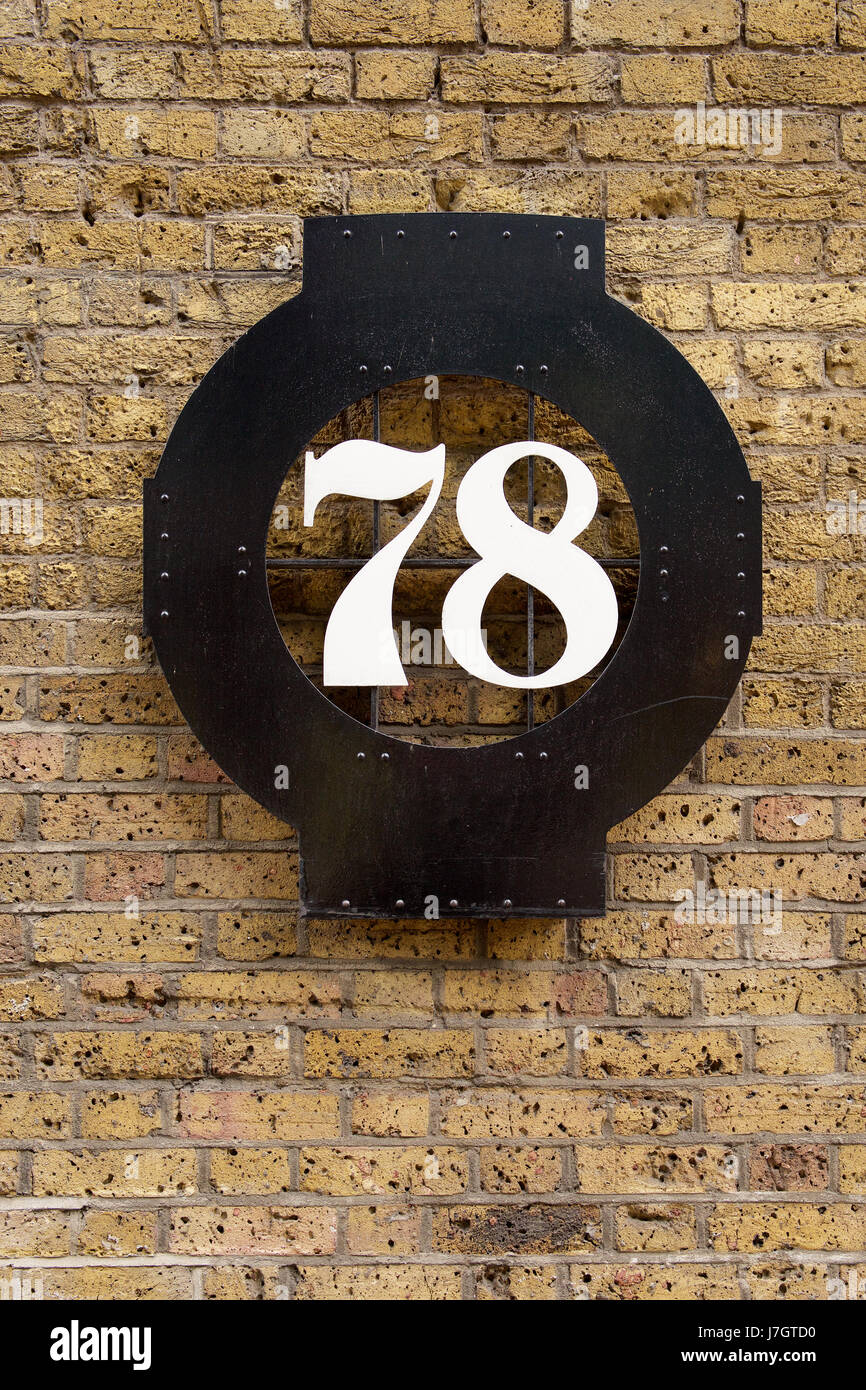 The number 78 on a wall Stock Photo - Alamy