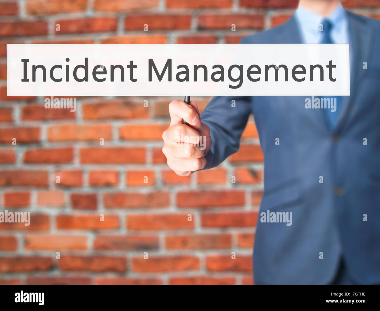 Incident Management - Businessman hand holding sign. Business ...