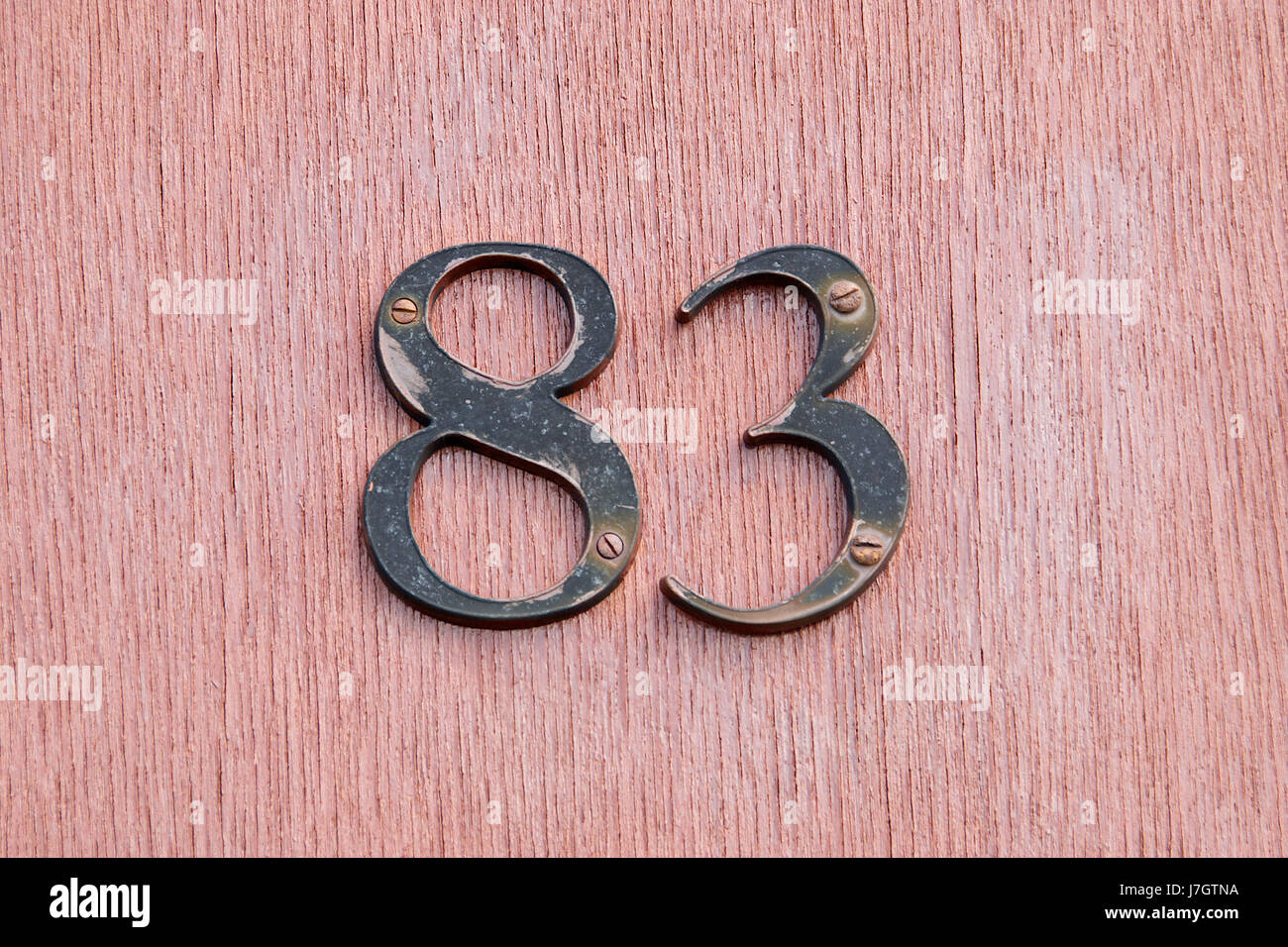 The number 83 on a beach hut Stock Photo - Alamy