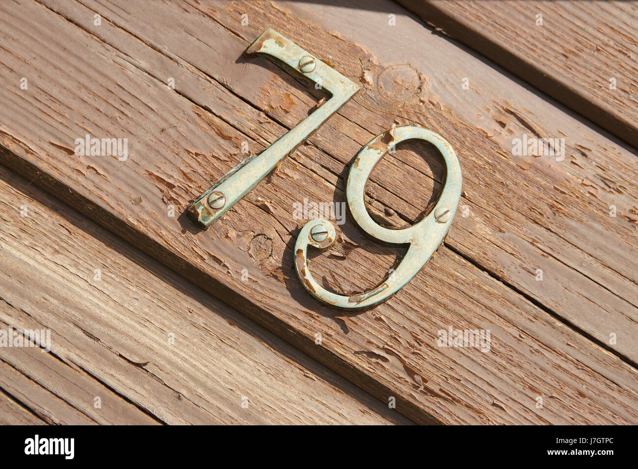 The number 79 on a beach hut Stock Photo - Alamy