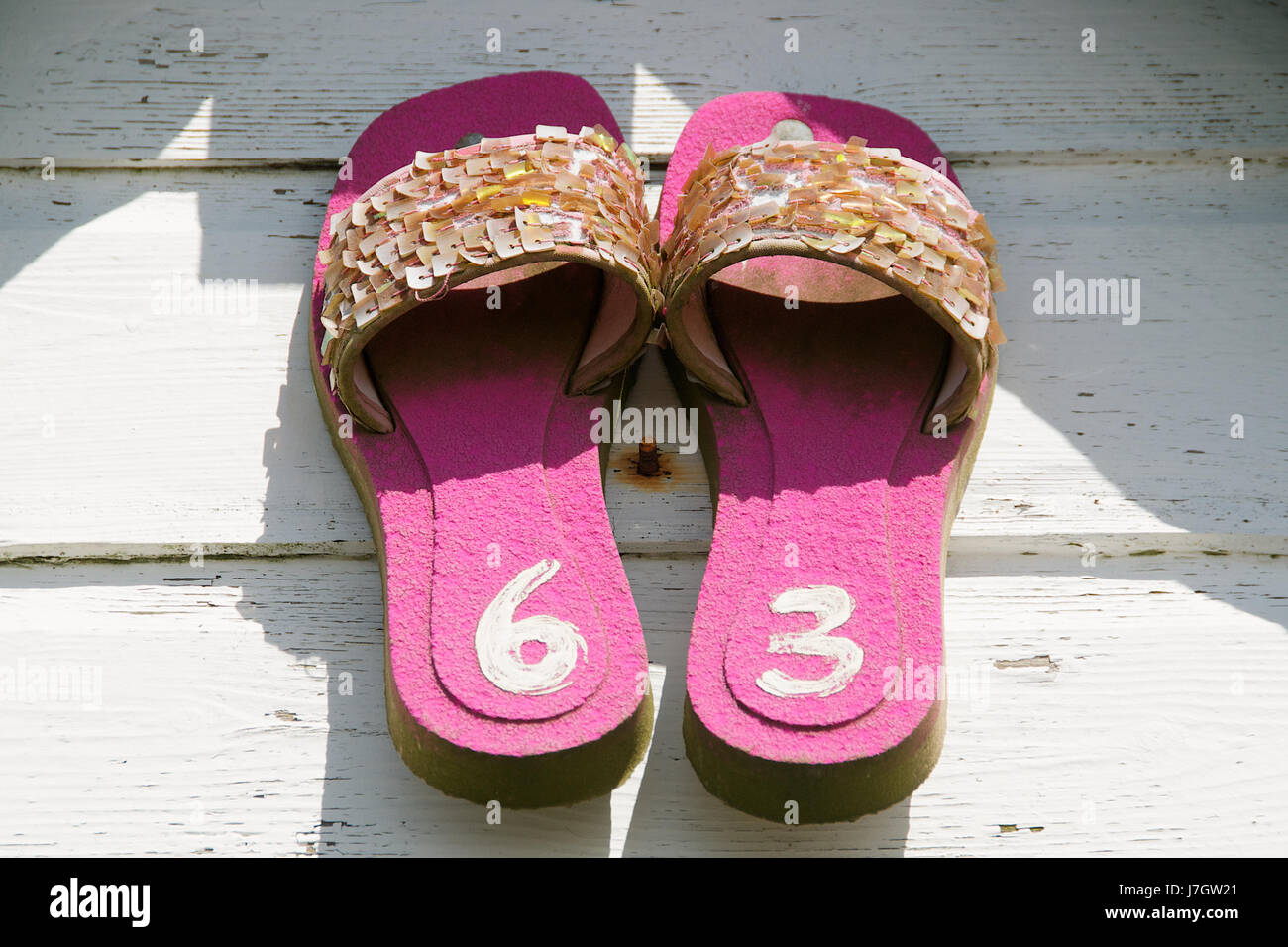 The number 63 on a beach hut Stock Photo - Alamy